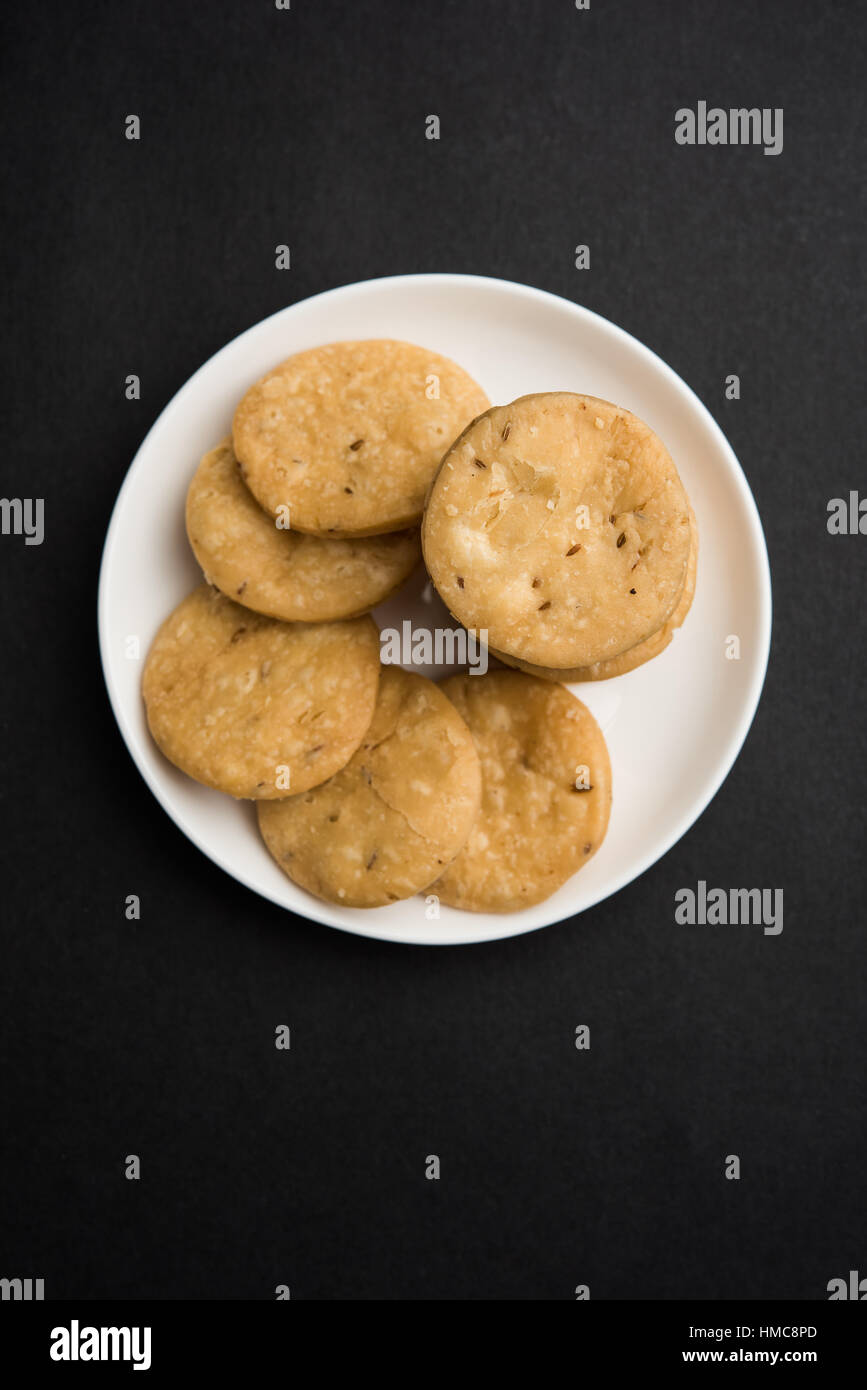 spicy fried mathri or mathari which is an indian snack served with a ...
