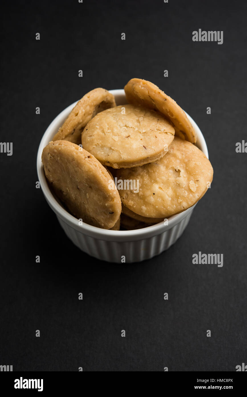 spicy fried mathri or mathari which is an indian snack served with a ...
