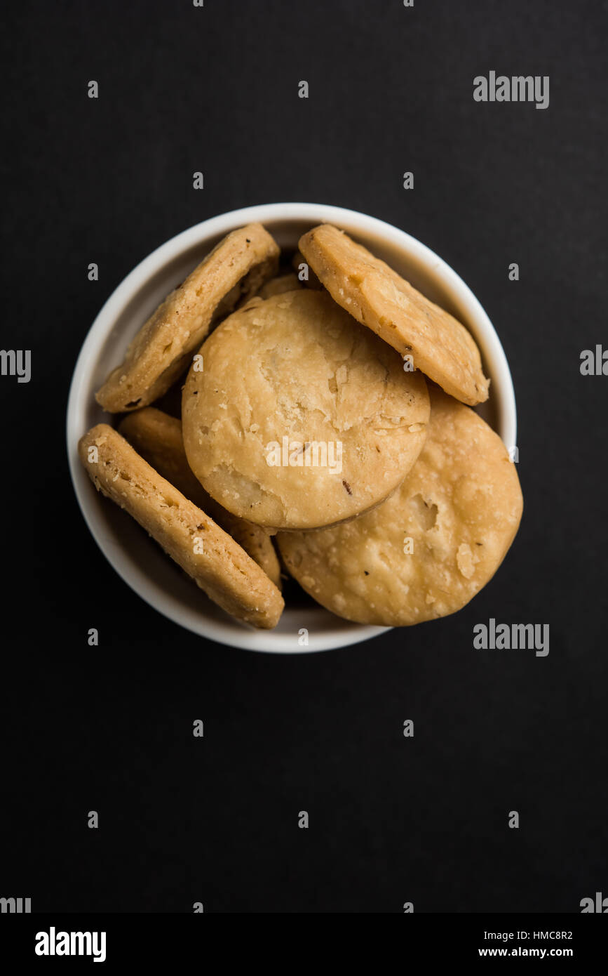 spicy fried mathri or mathari which is an indian snack served with a ...