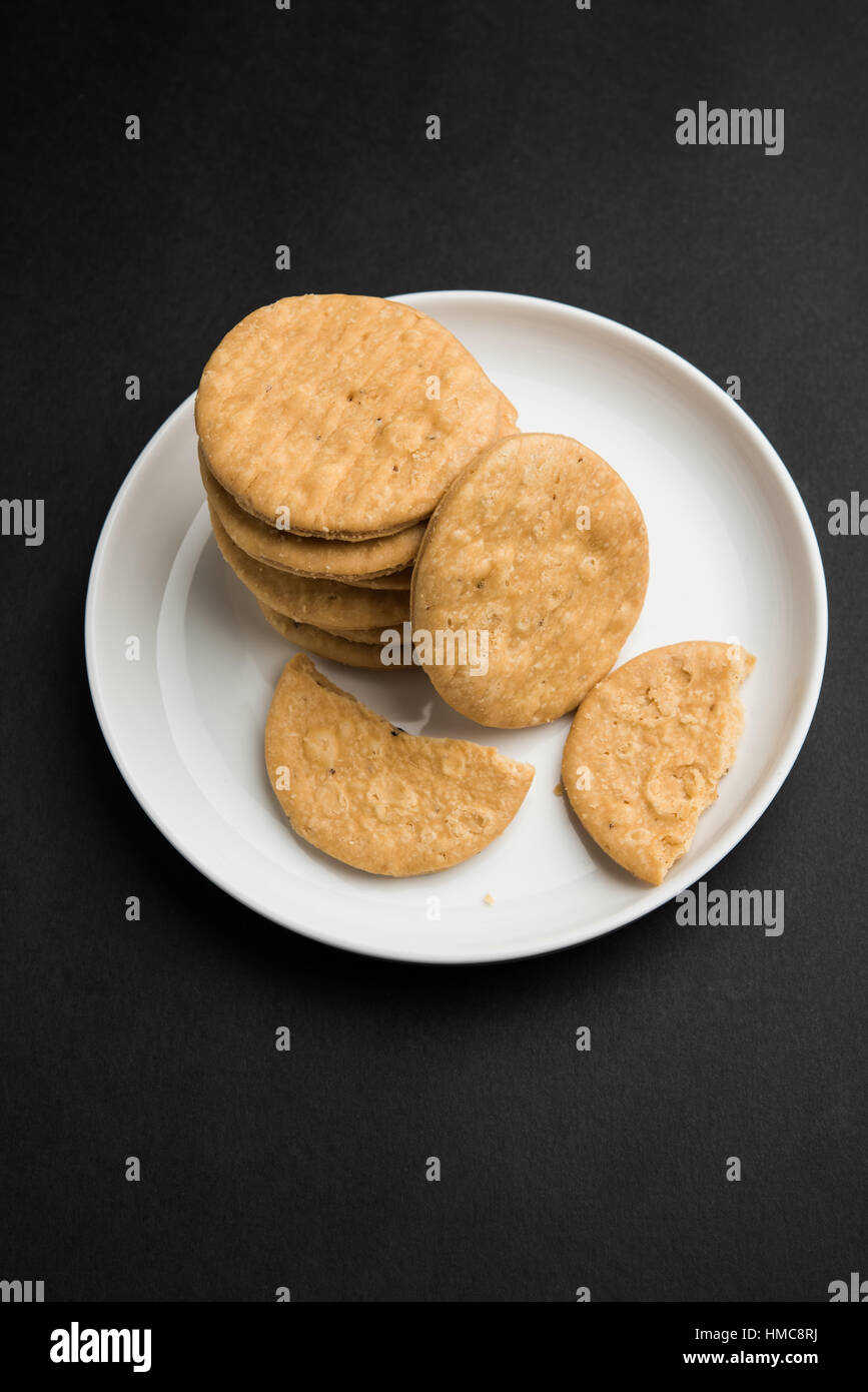 spicy fried mathri or mathari which is an indian snack served with a ...