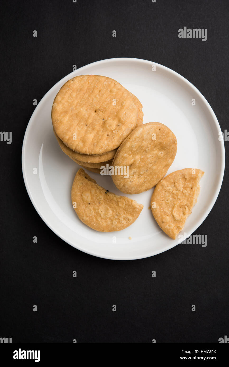spicy fried mathri or mathari which is an indian snack served with a ...