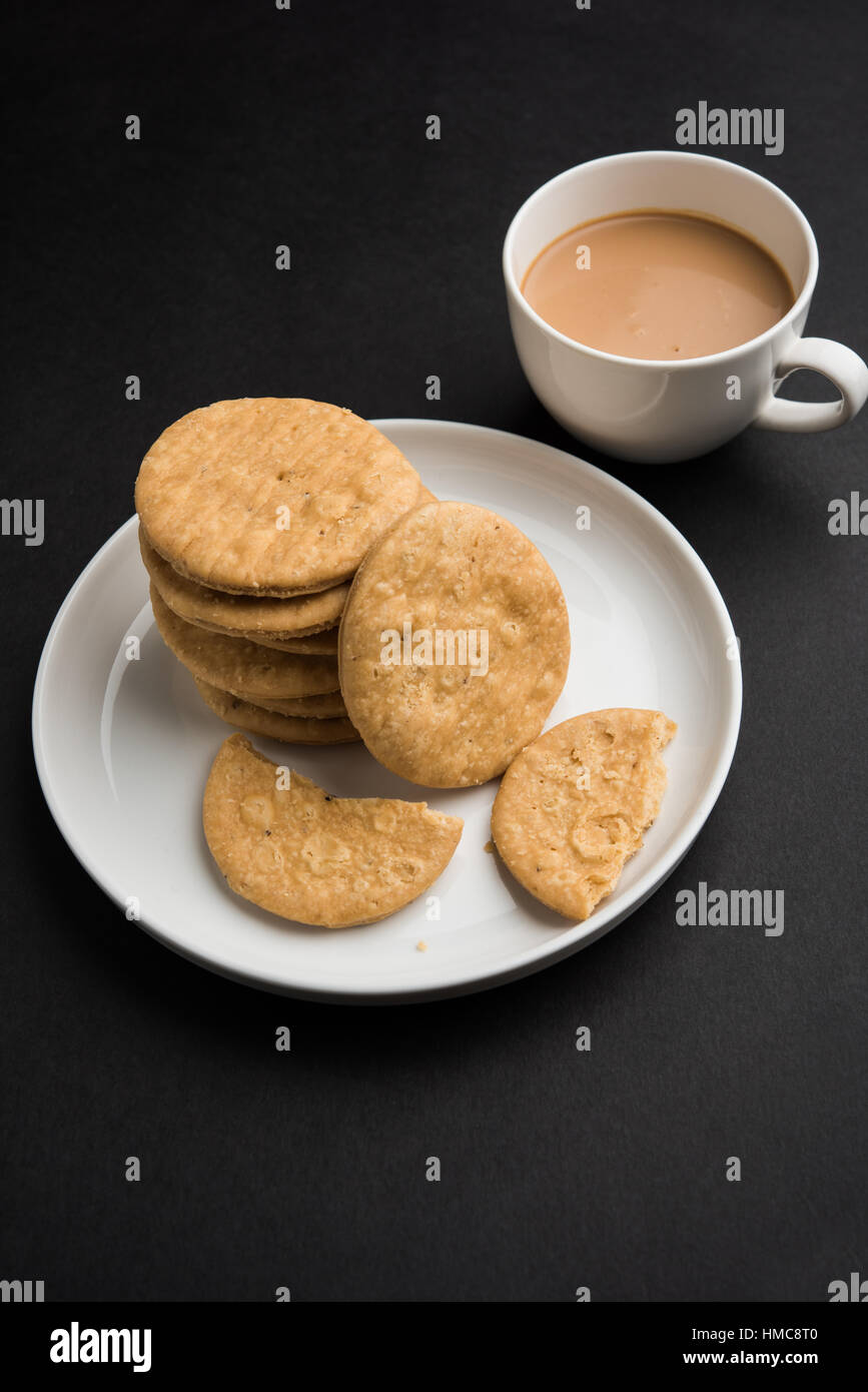 spicy fried mathri or mathari which is an indian snack served with a ...