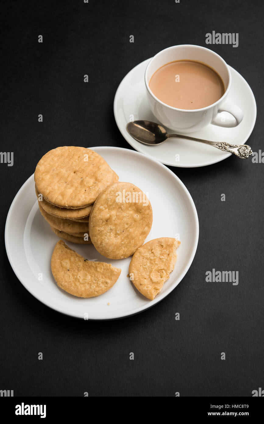 spicy fried mathri or mathari which is an indian snack served with a ...