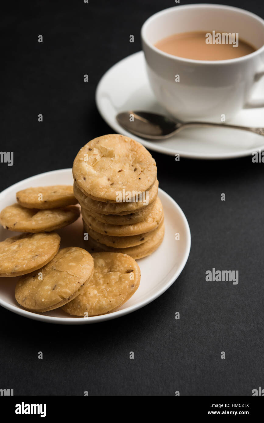 spicy fried mathri or mathari which is an indian snack served with a ...