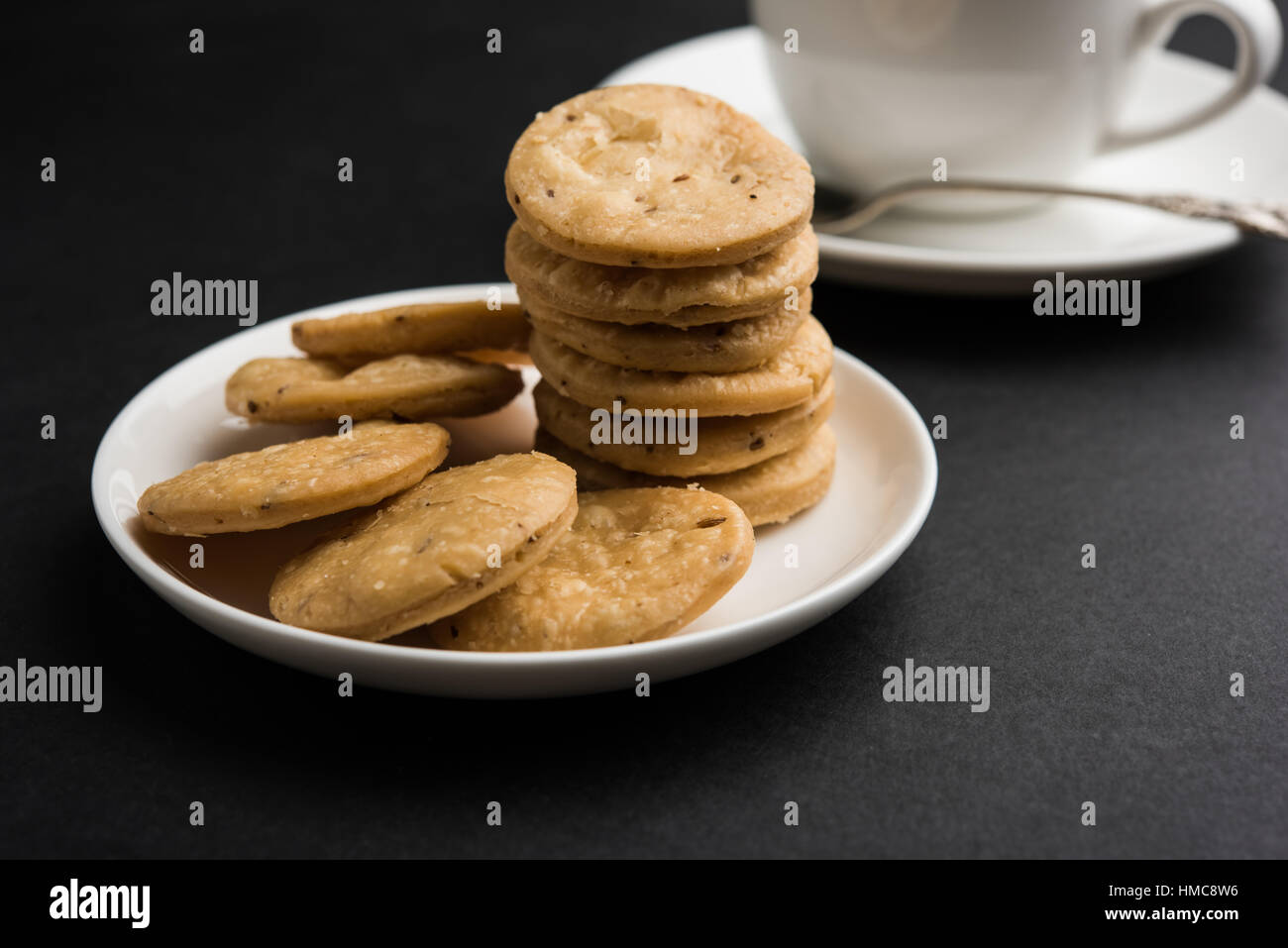 spicy fried mathri or mathari which is an indian snack served with a ...