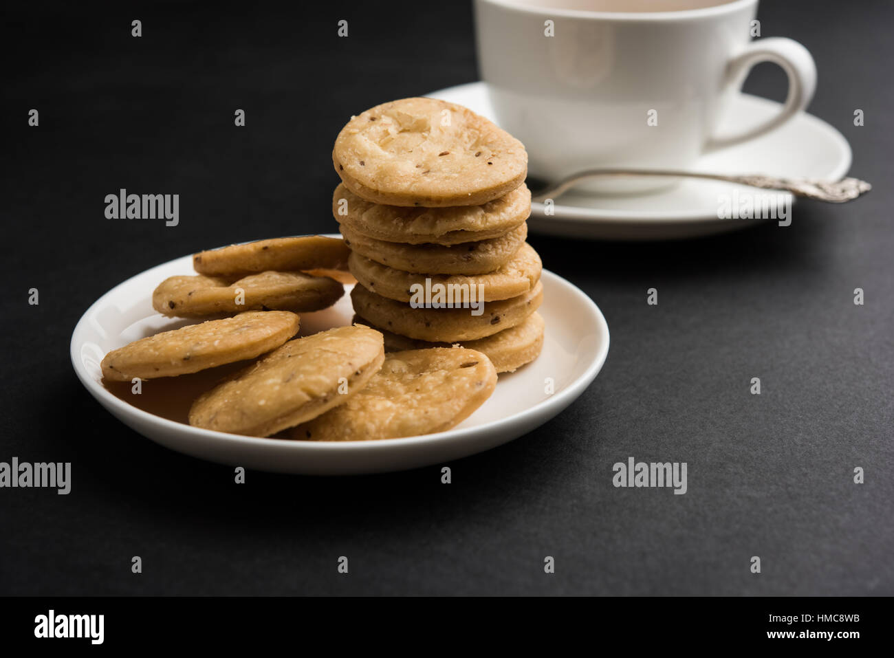 spicy fried mathri or mathari which is an indian snack served with a ...