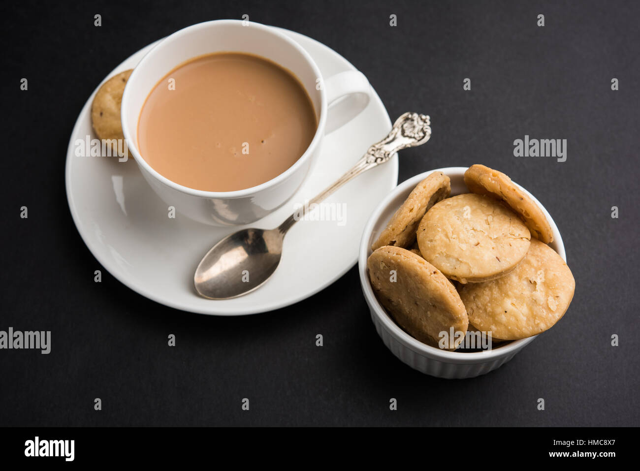 spicy fried mathri or mathari which is an indian snack served with a ...