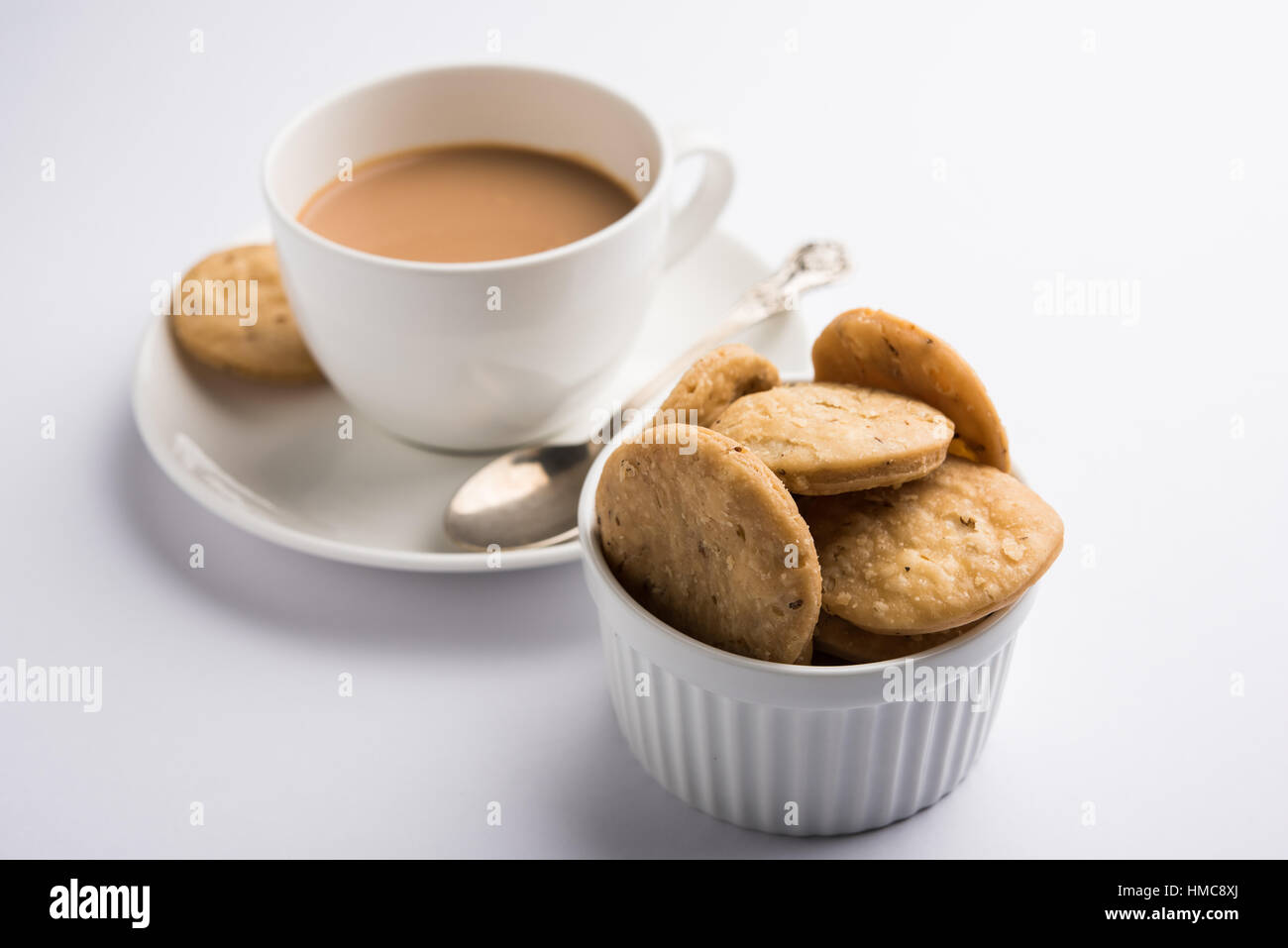 spicy fried mathri or mathari which is an indian snack served with a ...