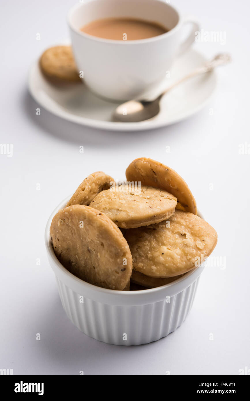 spicy fried mathri or mathari which is an indian snack served with a ...