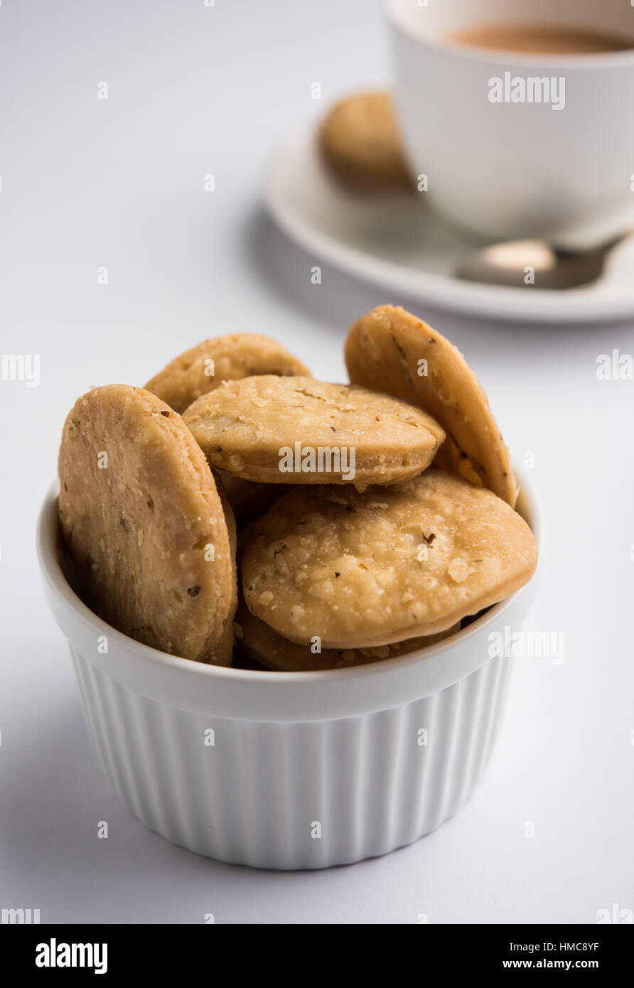 spicy fried mathri or mathari which is an indian snack served with a ...
