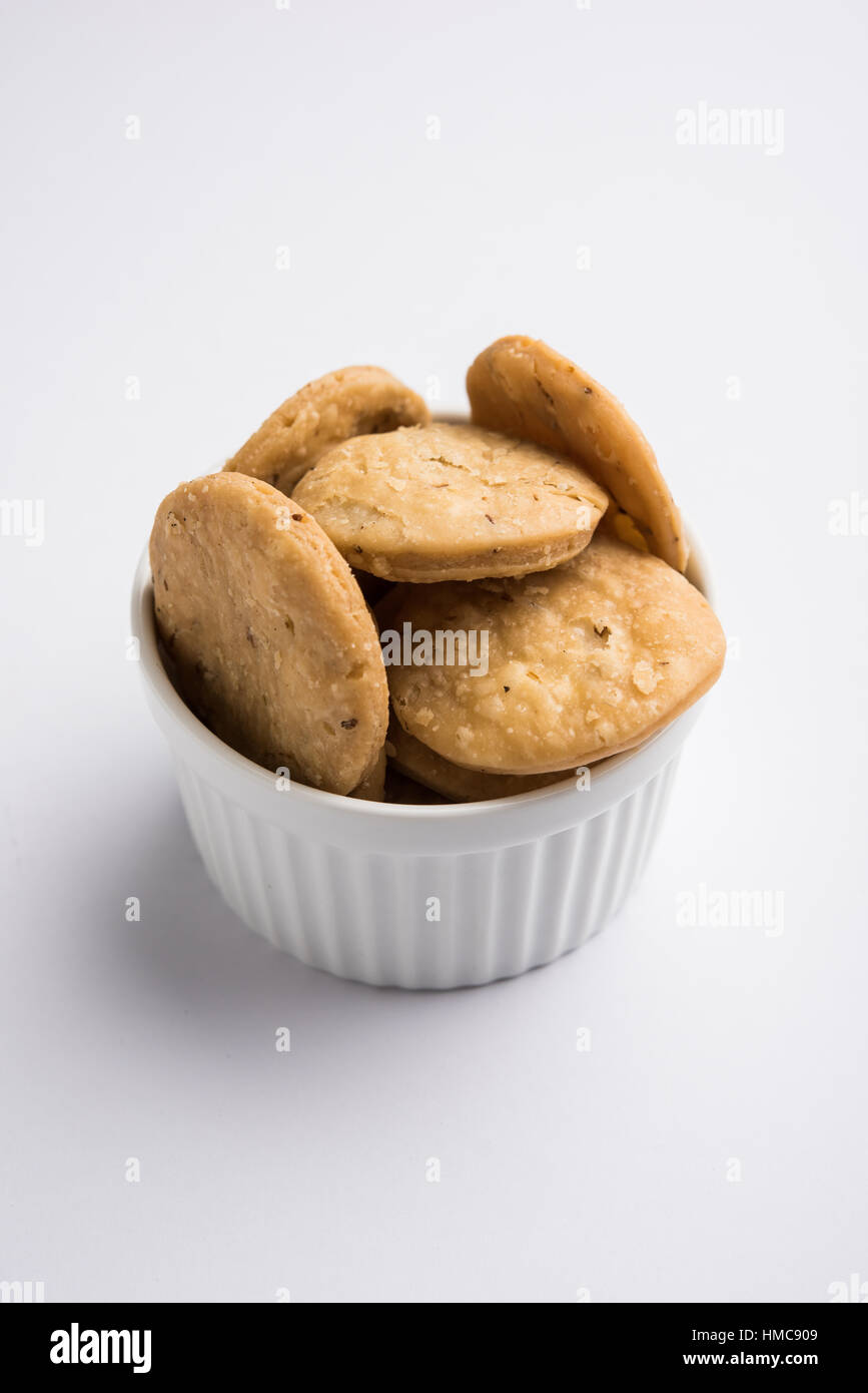 spicy fried mathri or mathari which is an indian snack served with a ...