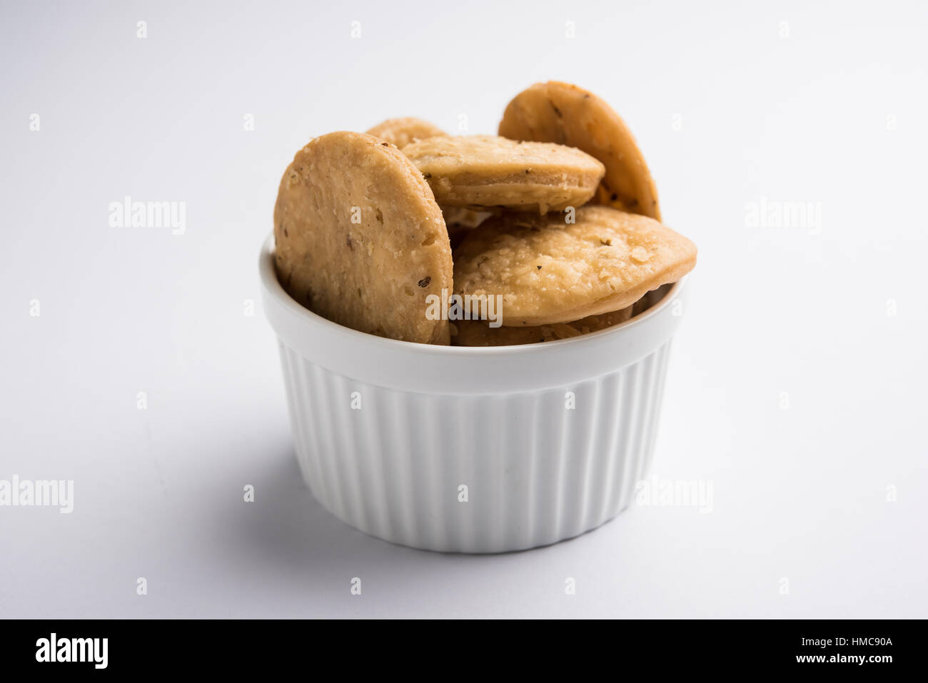 spicy fried mathri or mathari which is an indian snack served with a ...