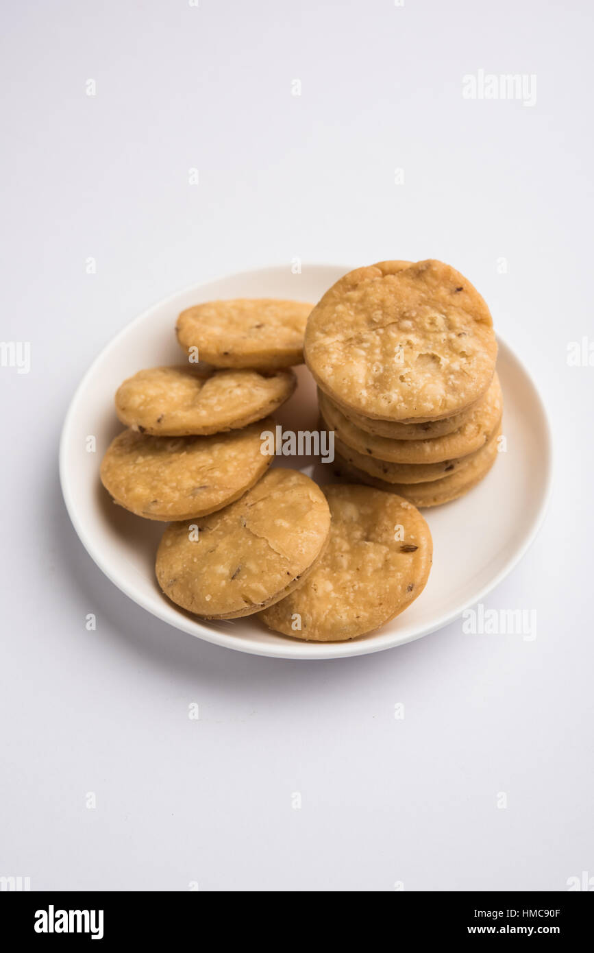 spicy fried mathri or mathari which is an indian snack served with a ...