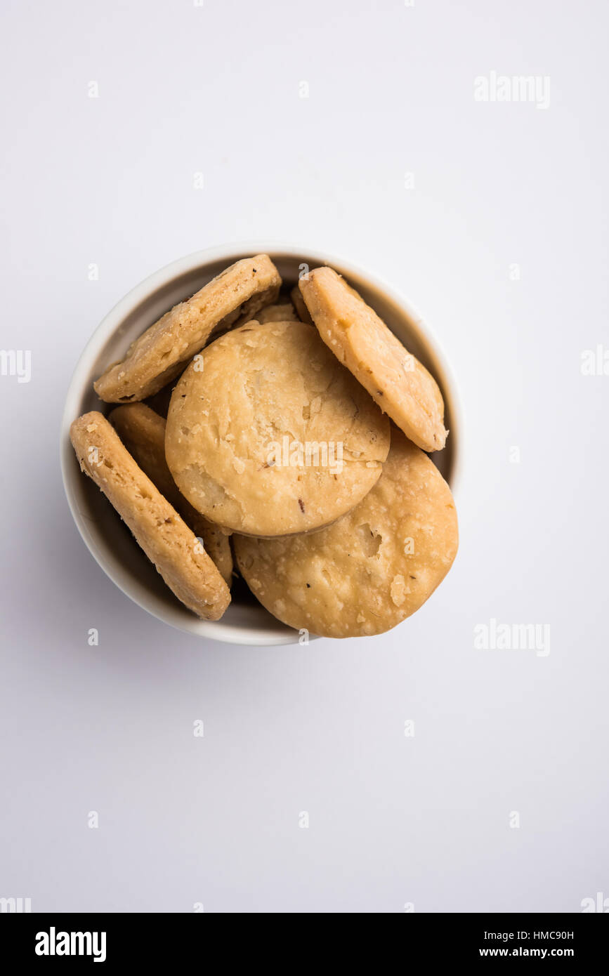 spicy fried mathri or mathari which is an indian snack served with a ...