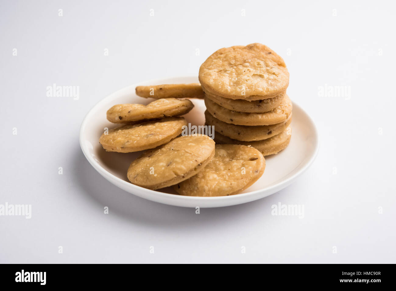 spicy fried mathri or mathari which is an indian snack served with a ...