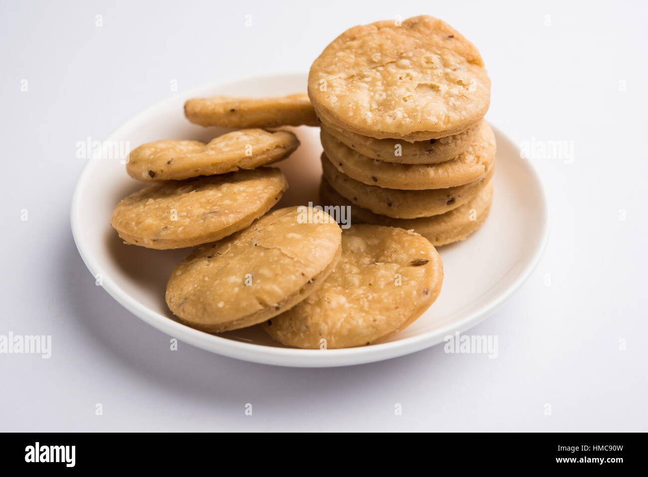 spicy fried mathri or mathari which is an indian snack served with a ...