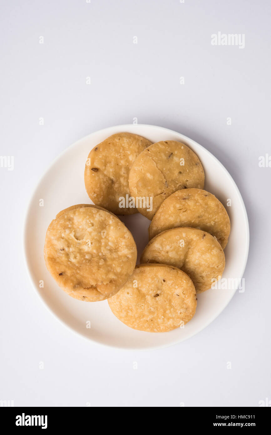 spicy fried mathri or mathari which is an indian snack served with a ...