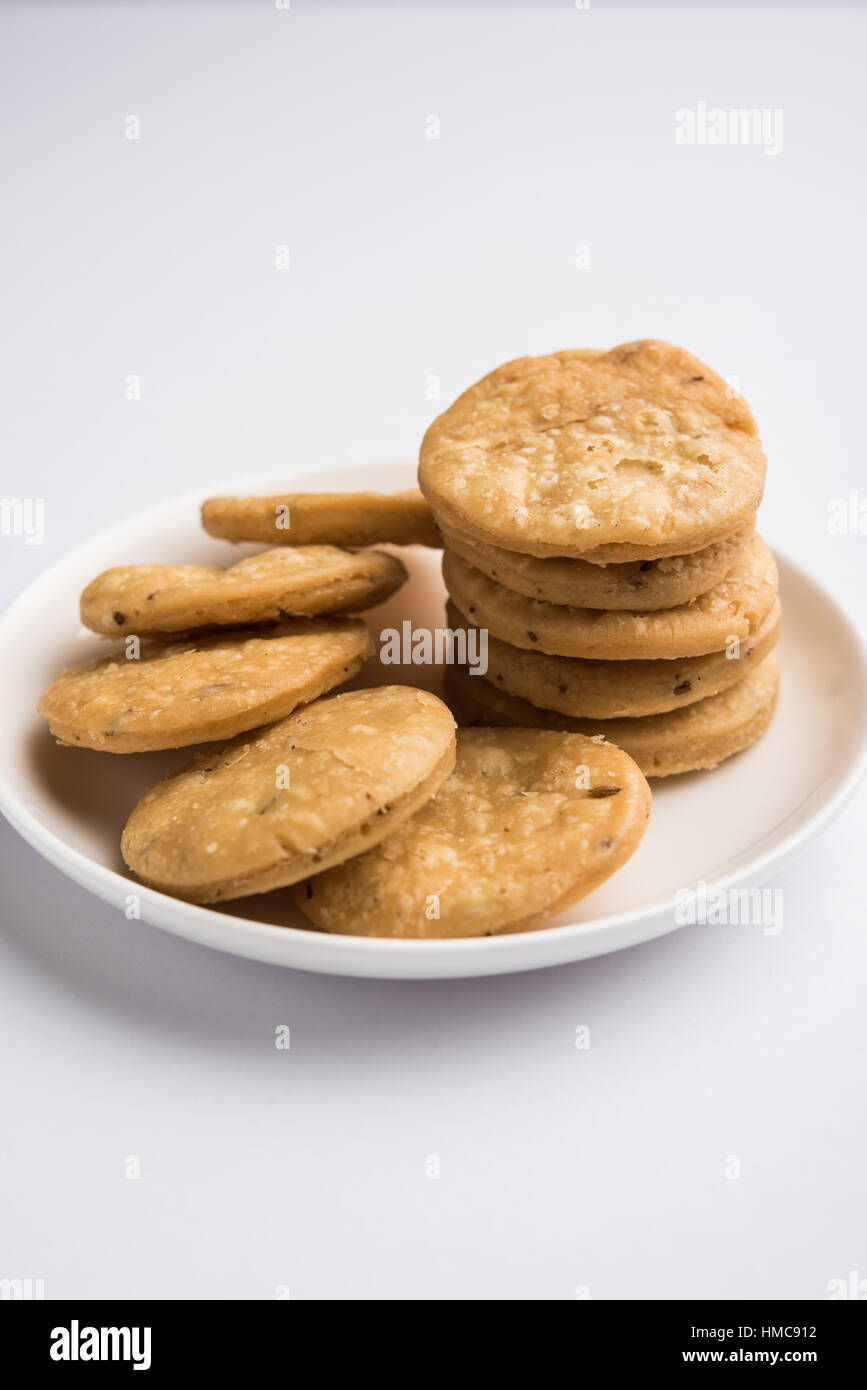 spicy fried mathri or mathari which is an indian snack served with a ...