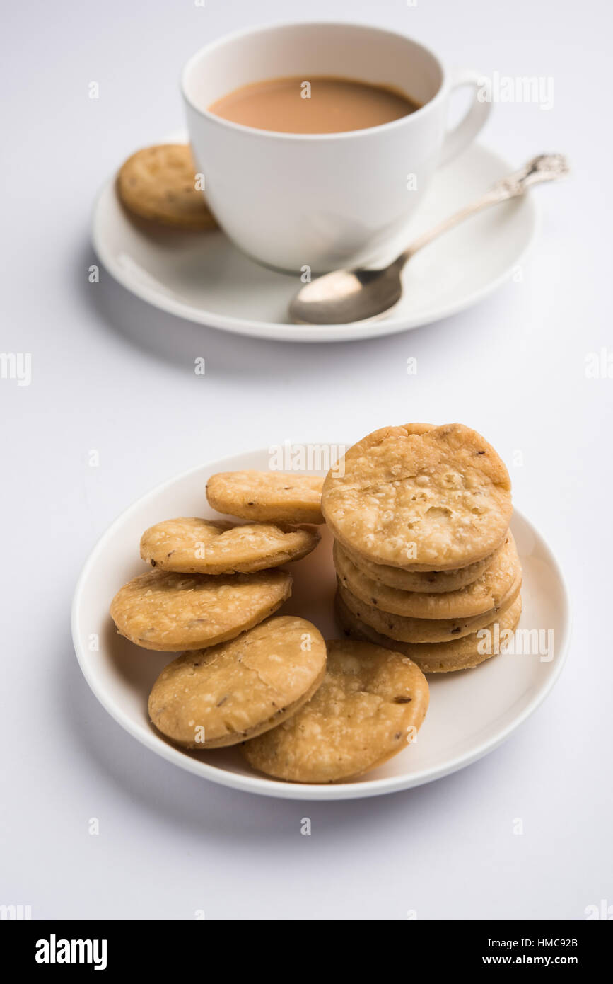 spicy fried mathri or mathari which is an indian snack served with a ...