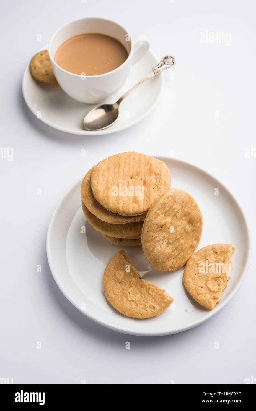 spicy fried mathri or mathari which is an indian snack served with a ...