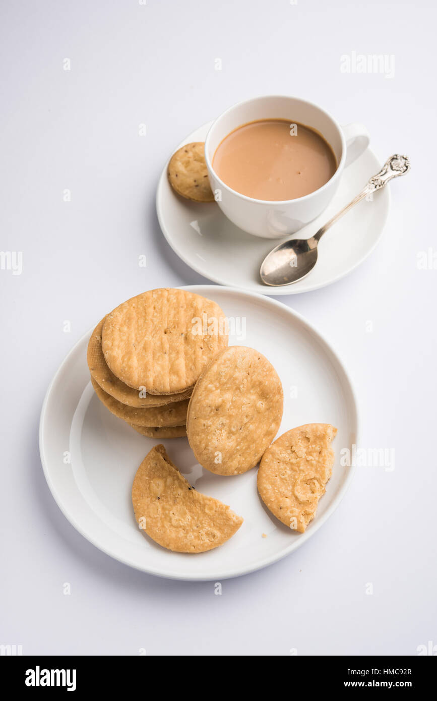 spicy fried mathri or mathari which is an indian snack served with a ...