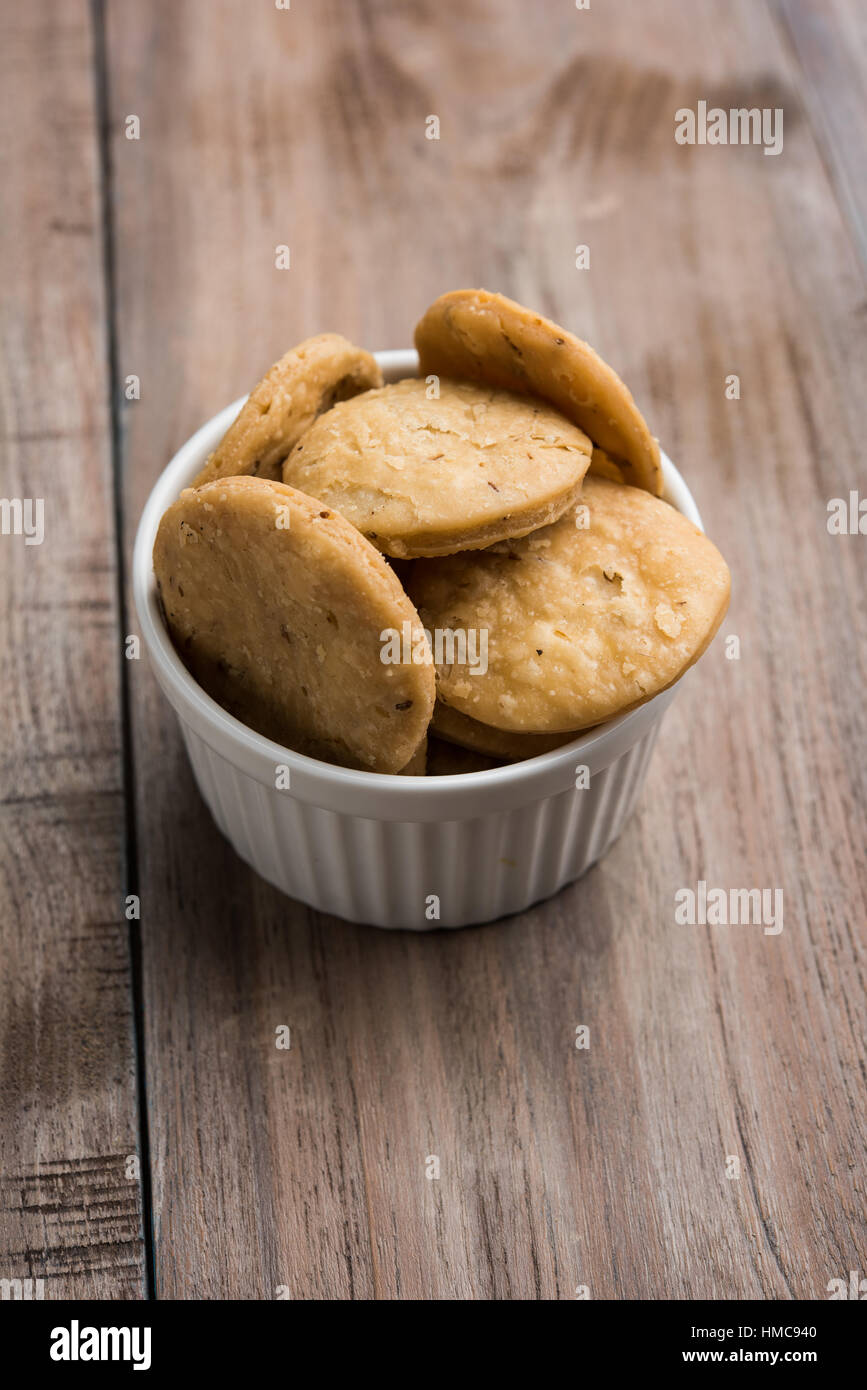 spicy fried mathri or mathari which is an indian snack served with a ...