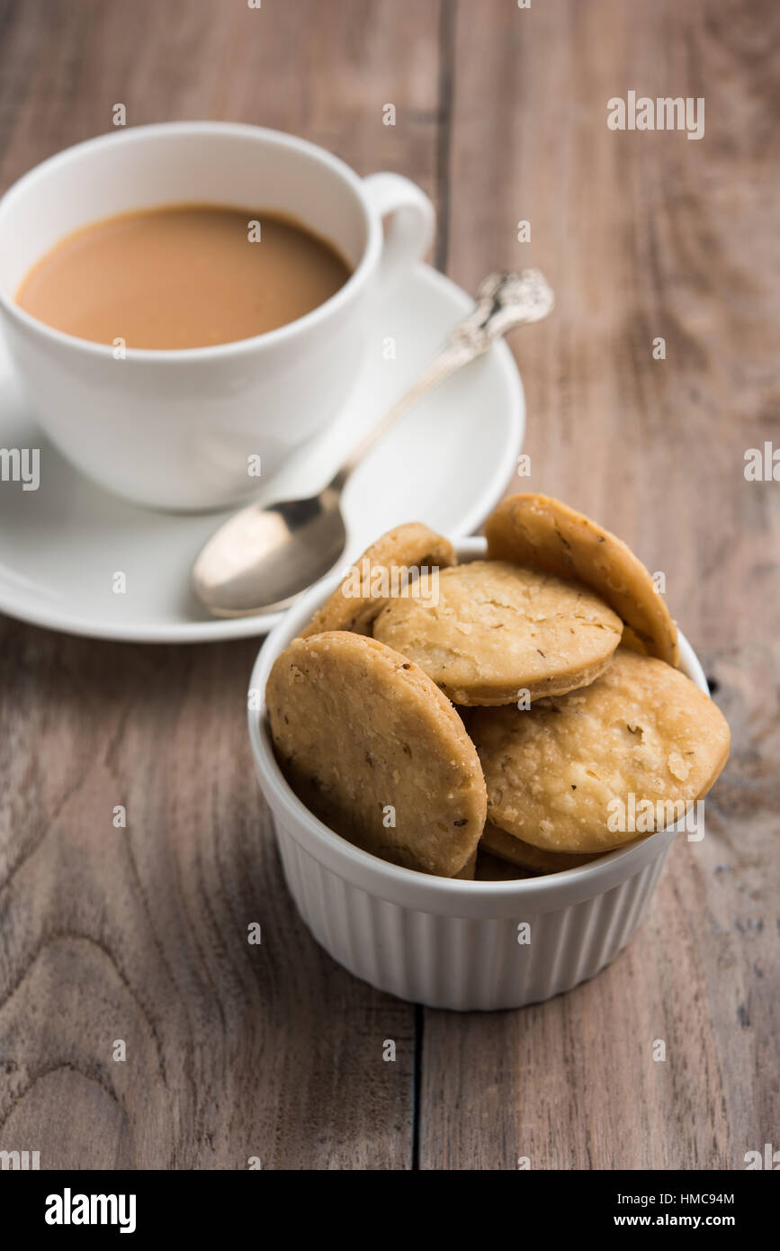 spicy fried mathri or mathari which is an indian snack served with a ...