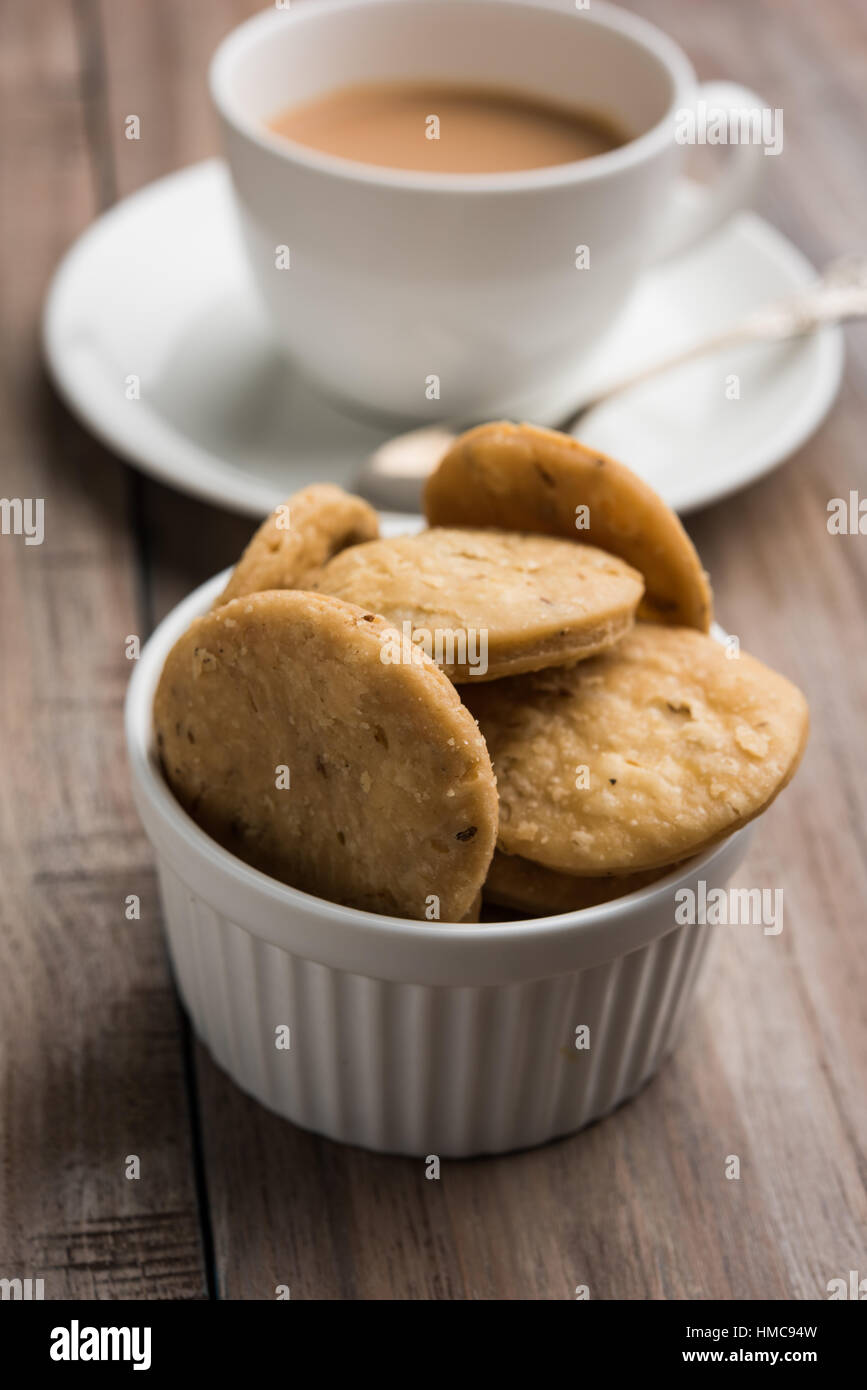 spicy fried mathri or mathari which is an indian snack served with a ...