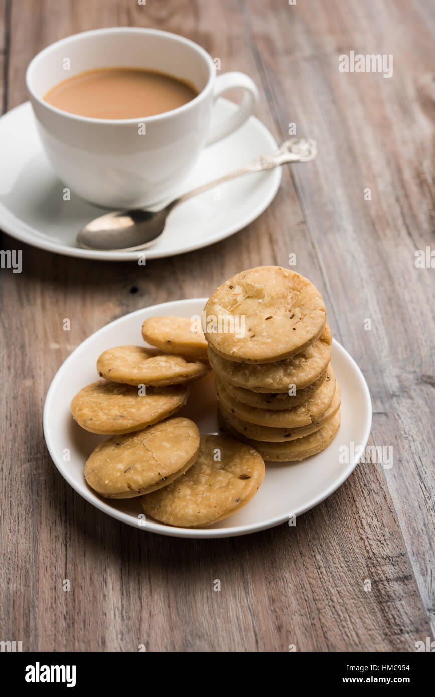 spicy fried mathri or mathari which is an indian snack served with a ...