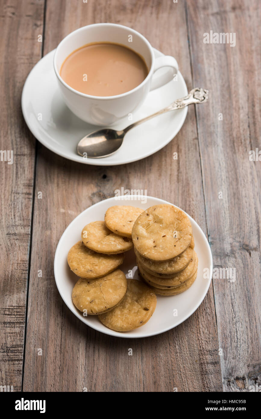 spicy fried mathri or mathari which is an indian snack served with a ...