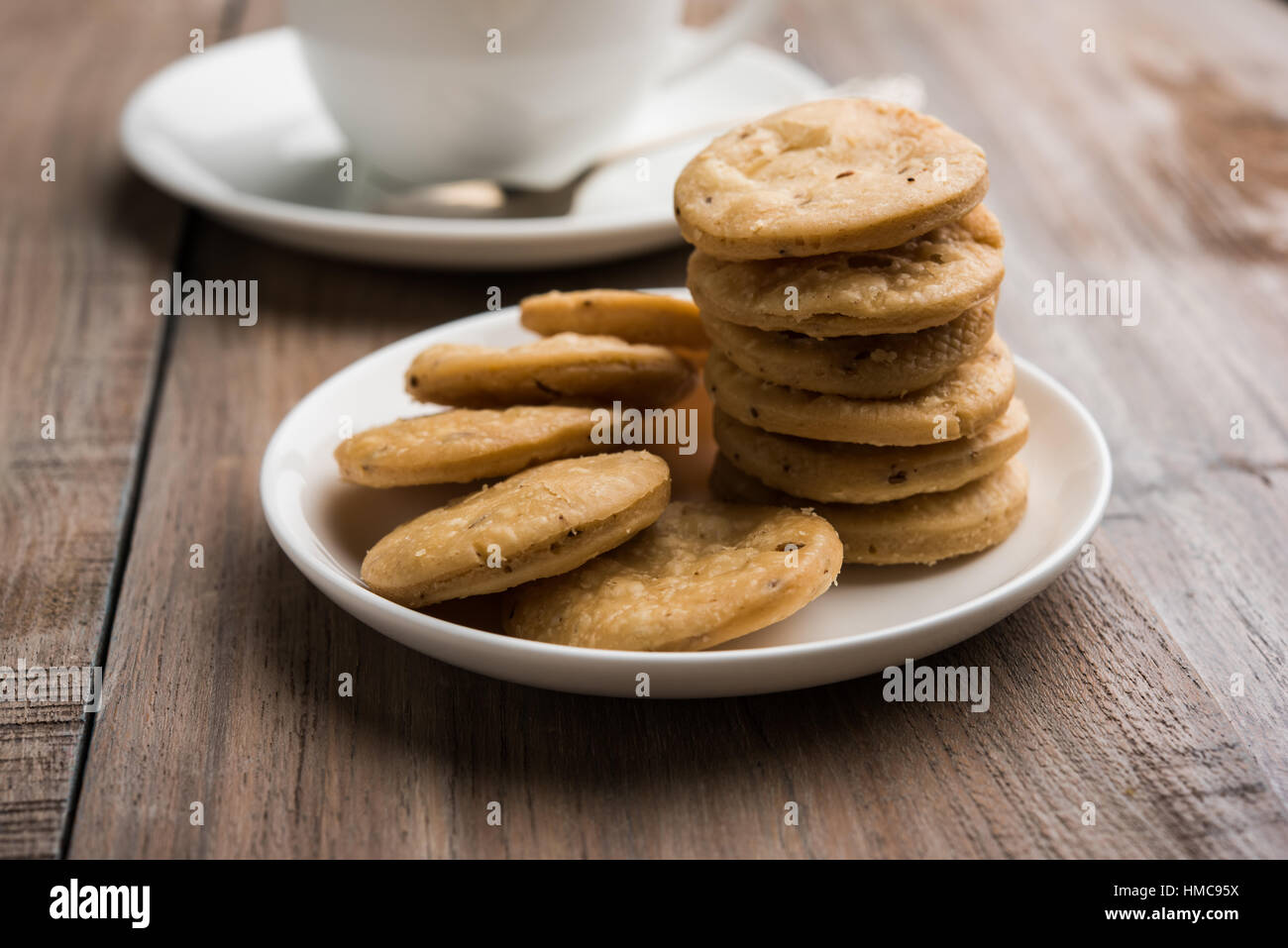 spicy fried mathri or mathari which is an indian snack served with a ...