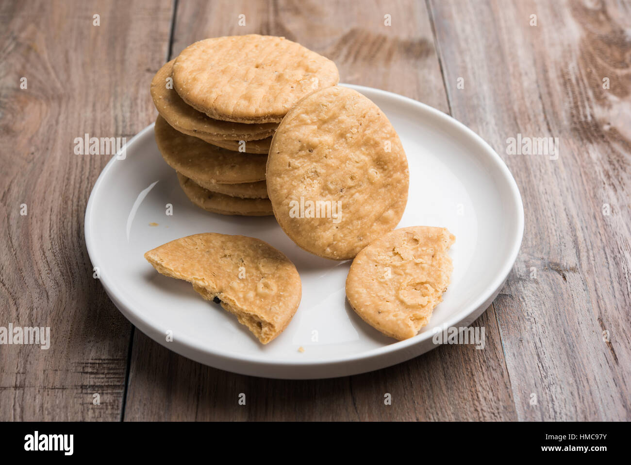 spicy fried mathri or mathari which is an indian snack served with a ...