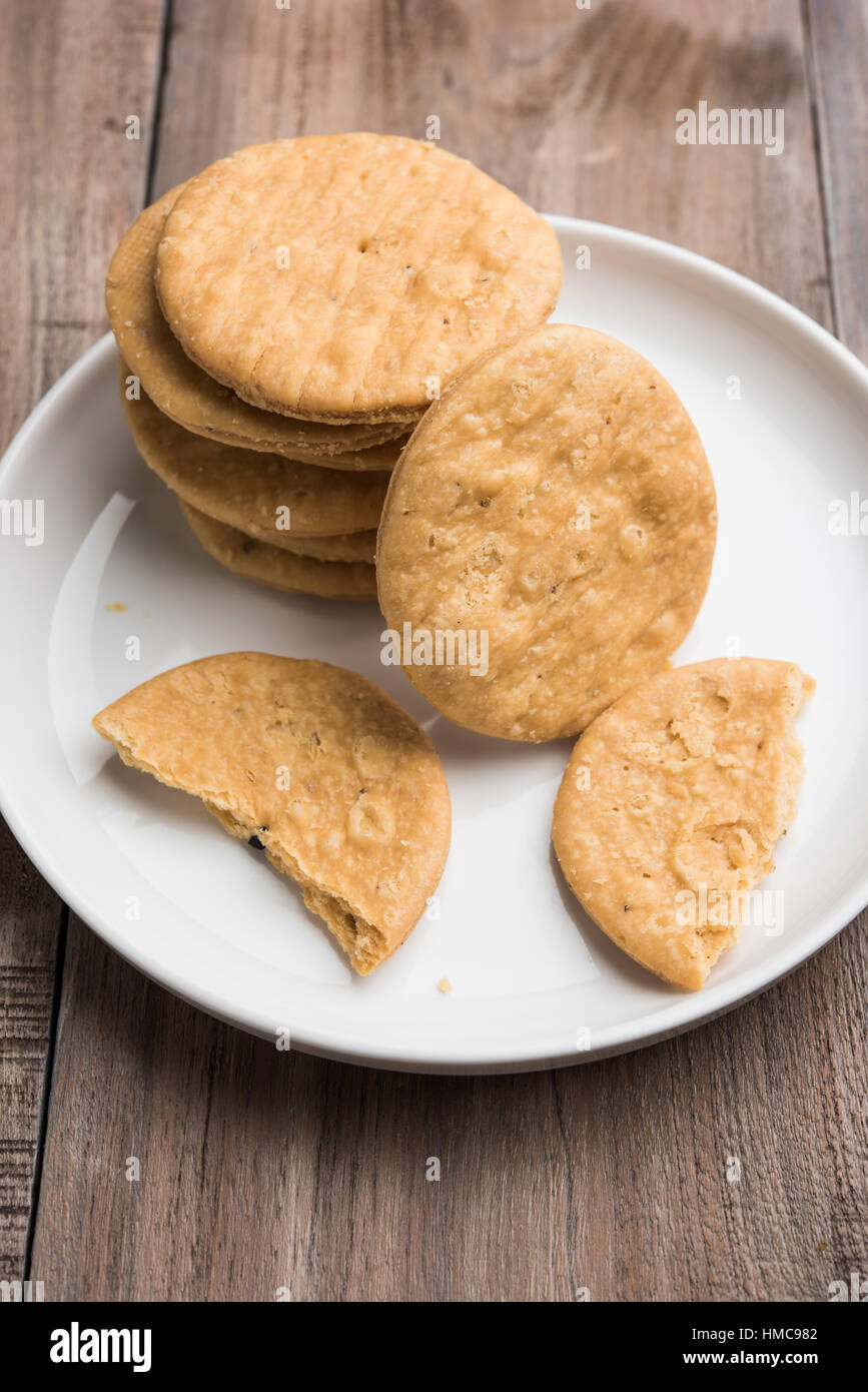 spicy fried mathri or mathari which is an indian snack served with a ...