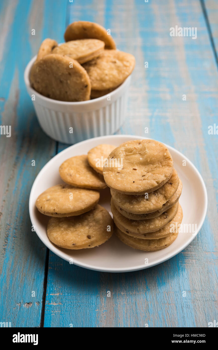 spicy fried mathri or mathari which is an indian snack served with a ...