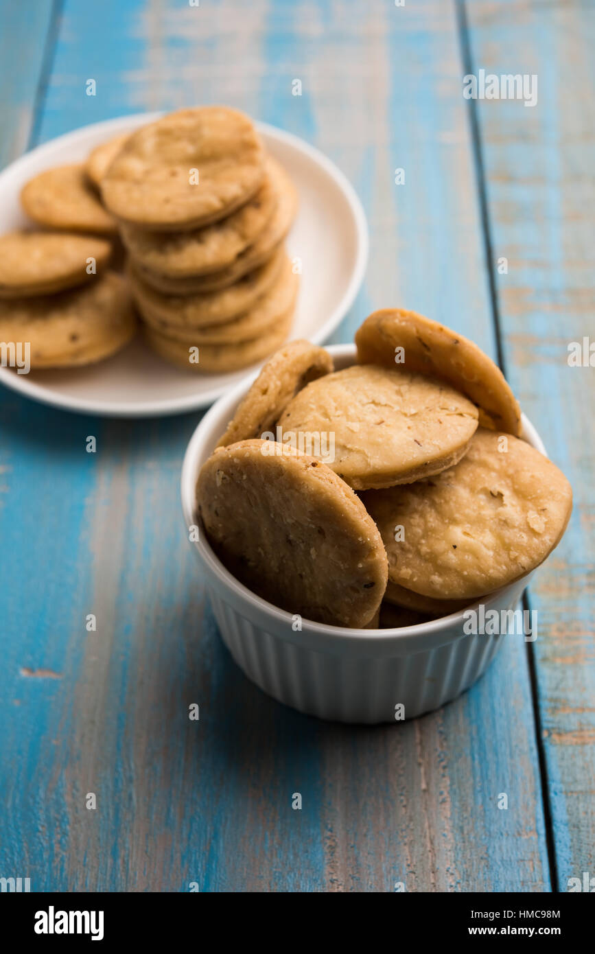 spicy fried mathri or mathari which is an indian snack served with a ...