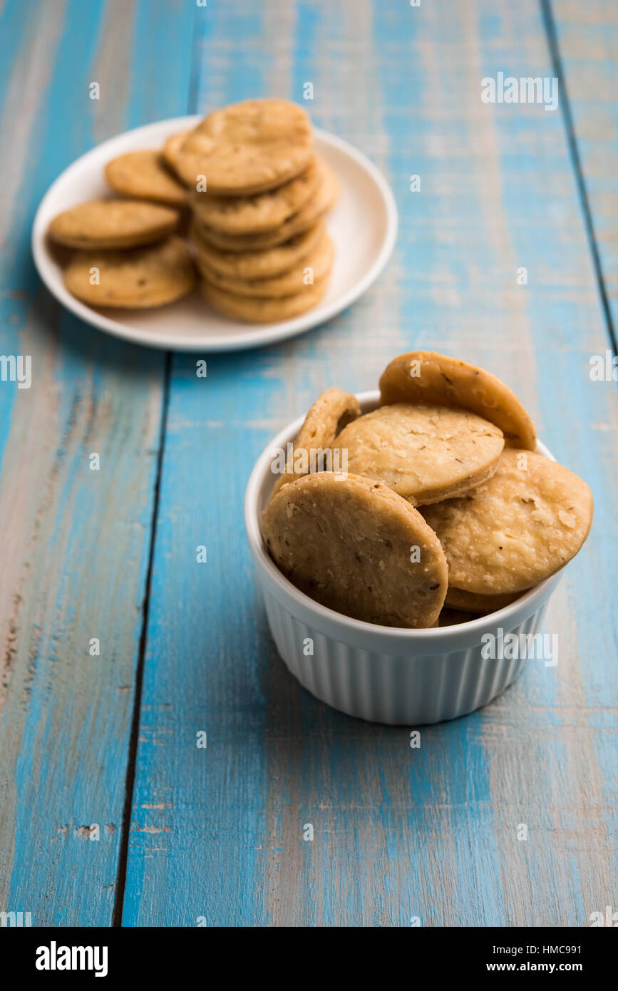 spicy fried mathri or mathari which is an indian snack served with a ...