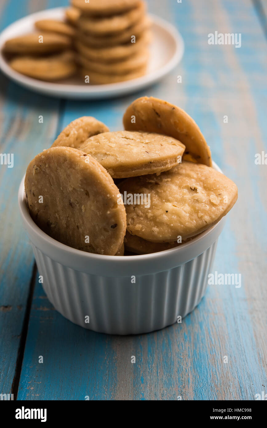 spicy fried mathri or mathari which is an indian snack served with a ...