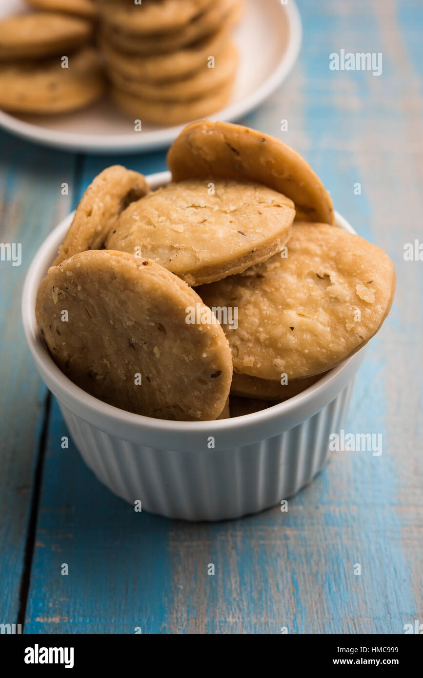 spicy fried mathri or mathari which is an indian snack served with a ...