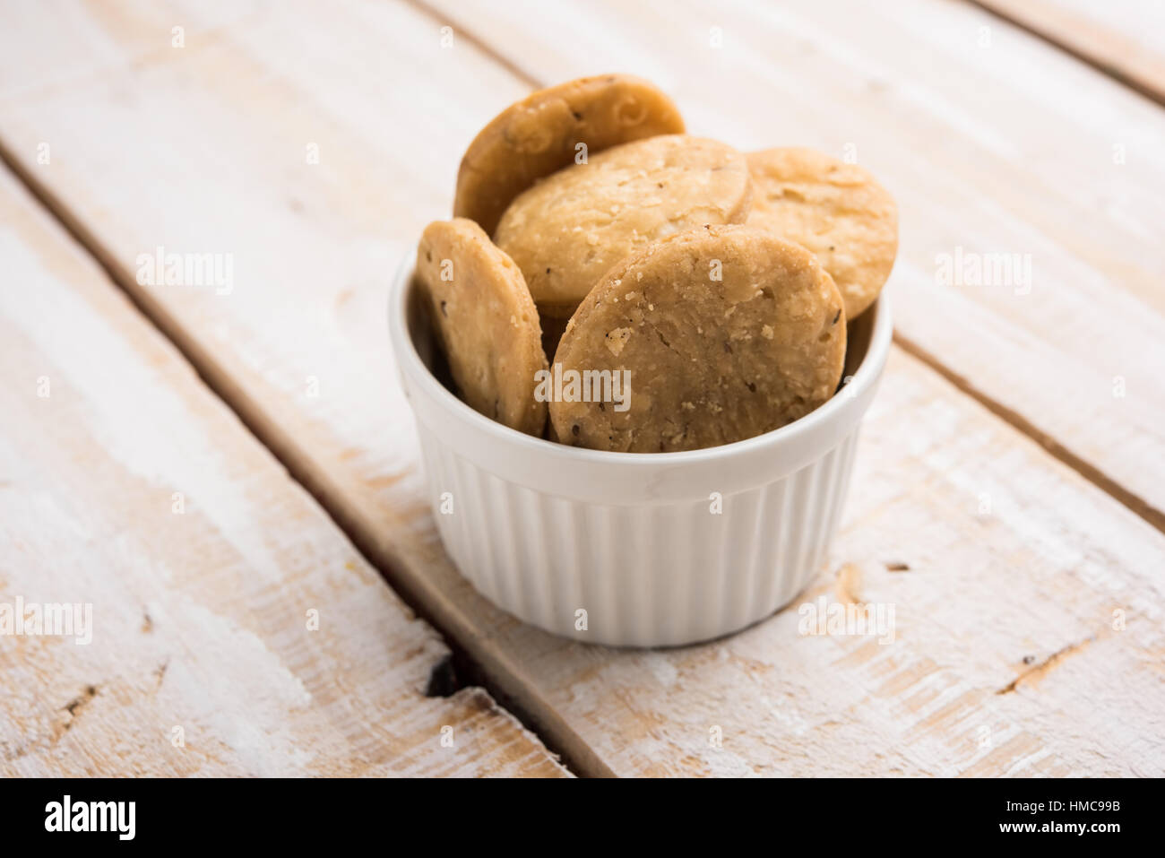 spicy fried mathri or mathari which is an indian snack served with a ...