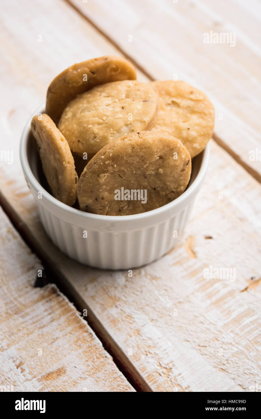 spicy fried mathri or mathari which is an indian snack served with a ...