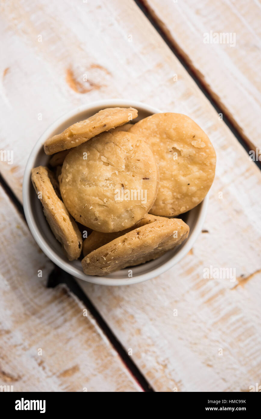 spicy fried mathri or mathari which is an indian snack served with a ...