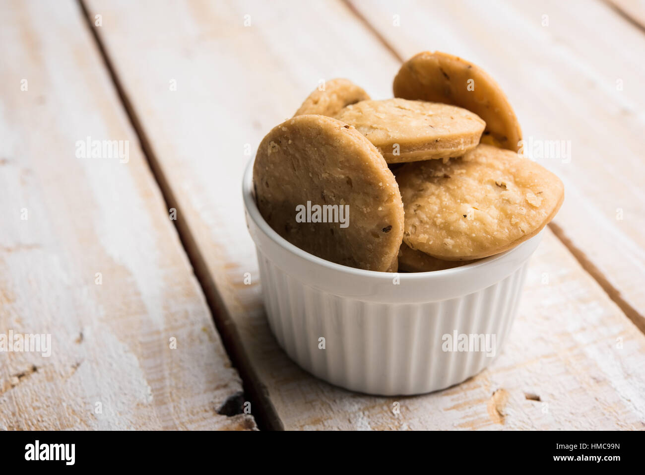 spicy fried mathri or mathari which is an indian snack served with a ...