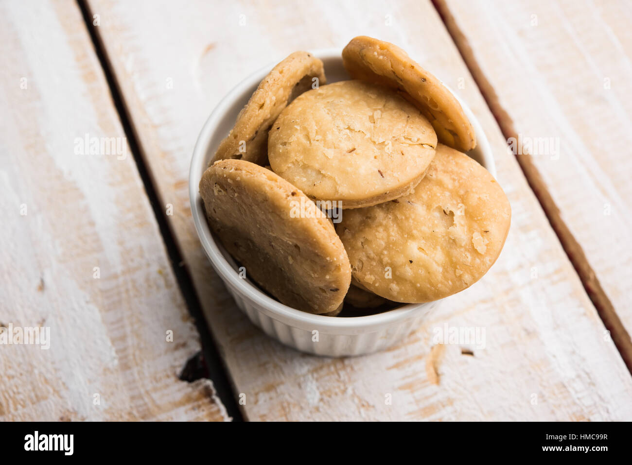 spicy fried mathri or mathari which is an indian snack served with a ...