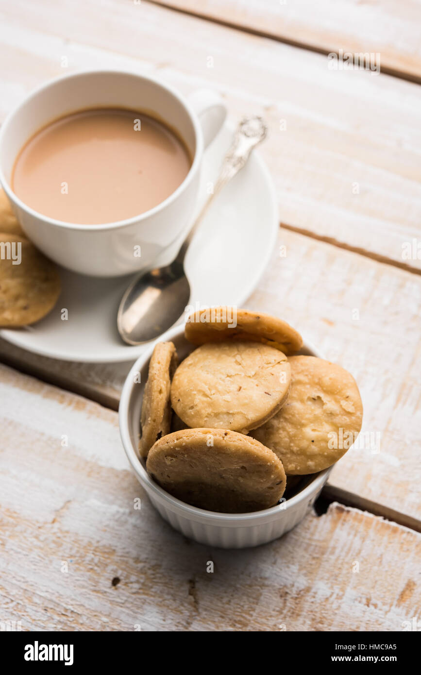 spicy fried mathri or mathari which is an indian snack served with a ...