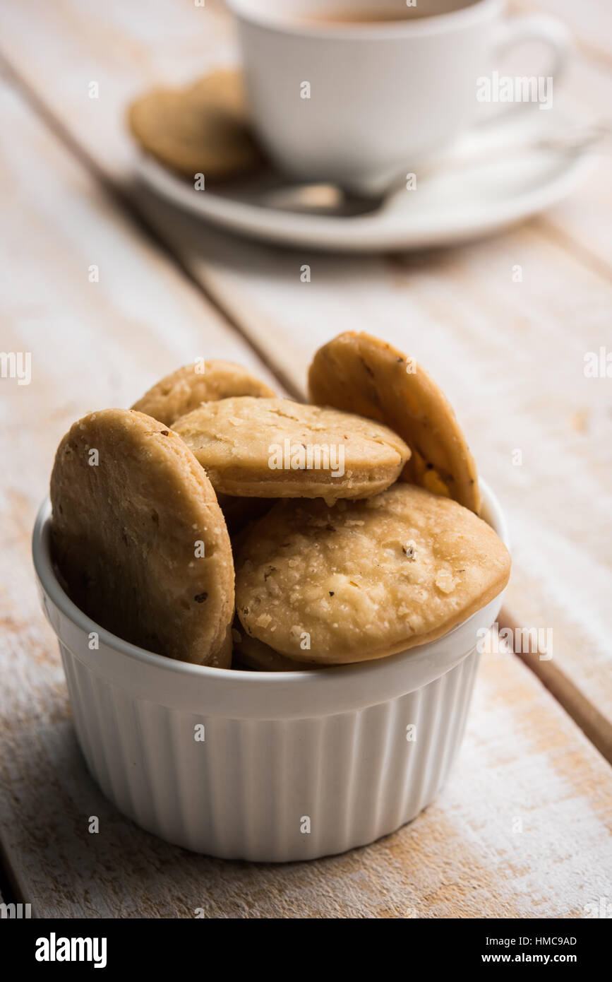 spicy fried mathri or mathari which is an indian snack served with a ...
