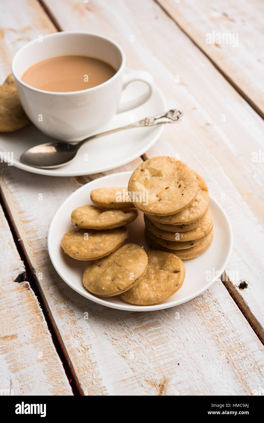 spicy fried mathri or mathari which is an indian snack served with a ...