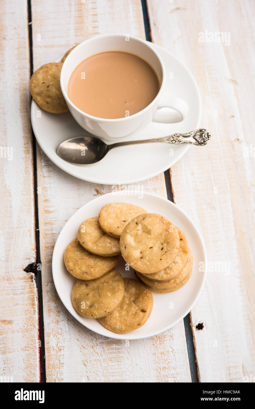 spicy fried mathri or mathari which is an indian snack served with a ...