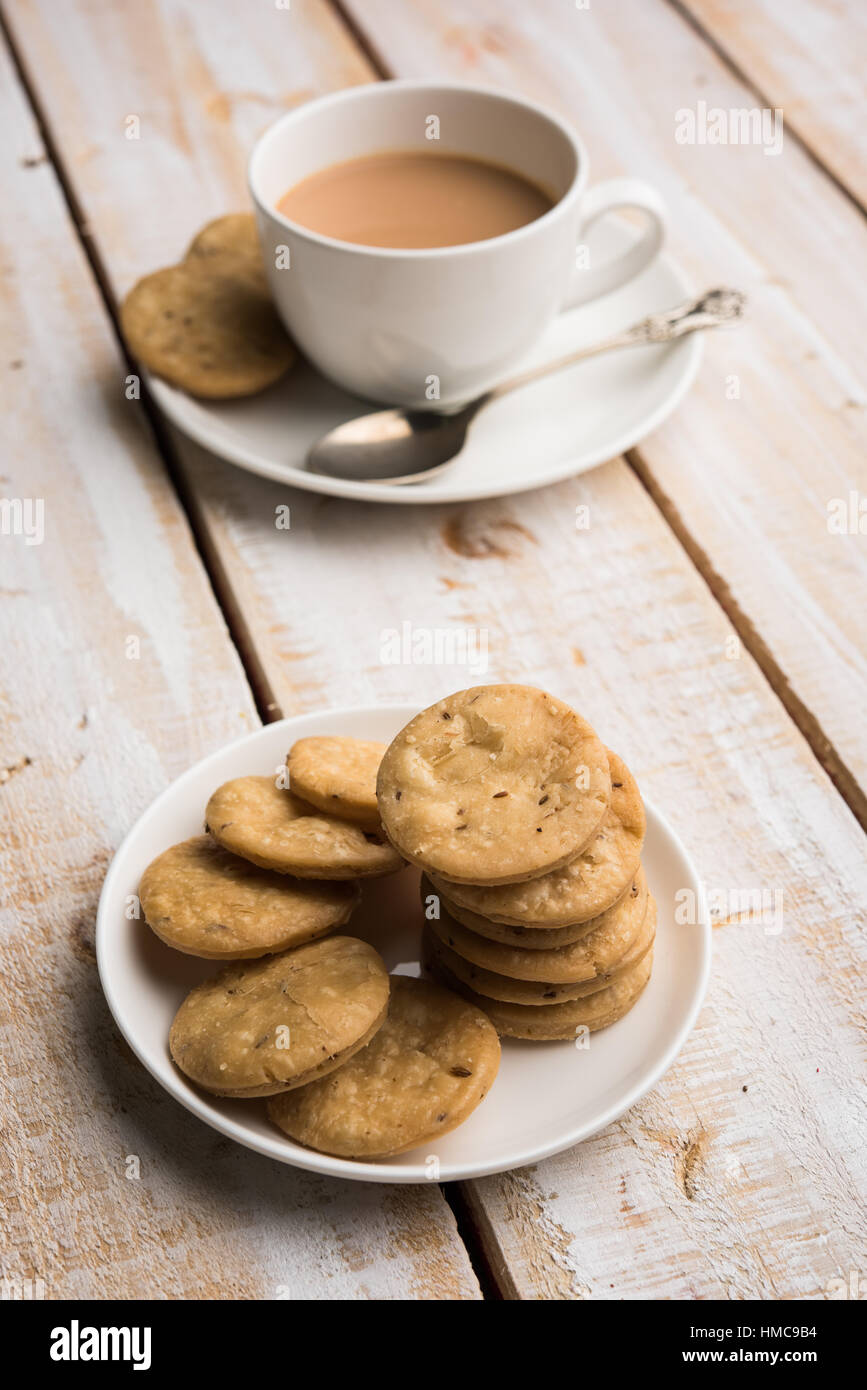 spicy fried mathri or mathari which is an indian snack served with a ...
