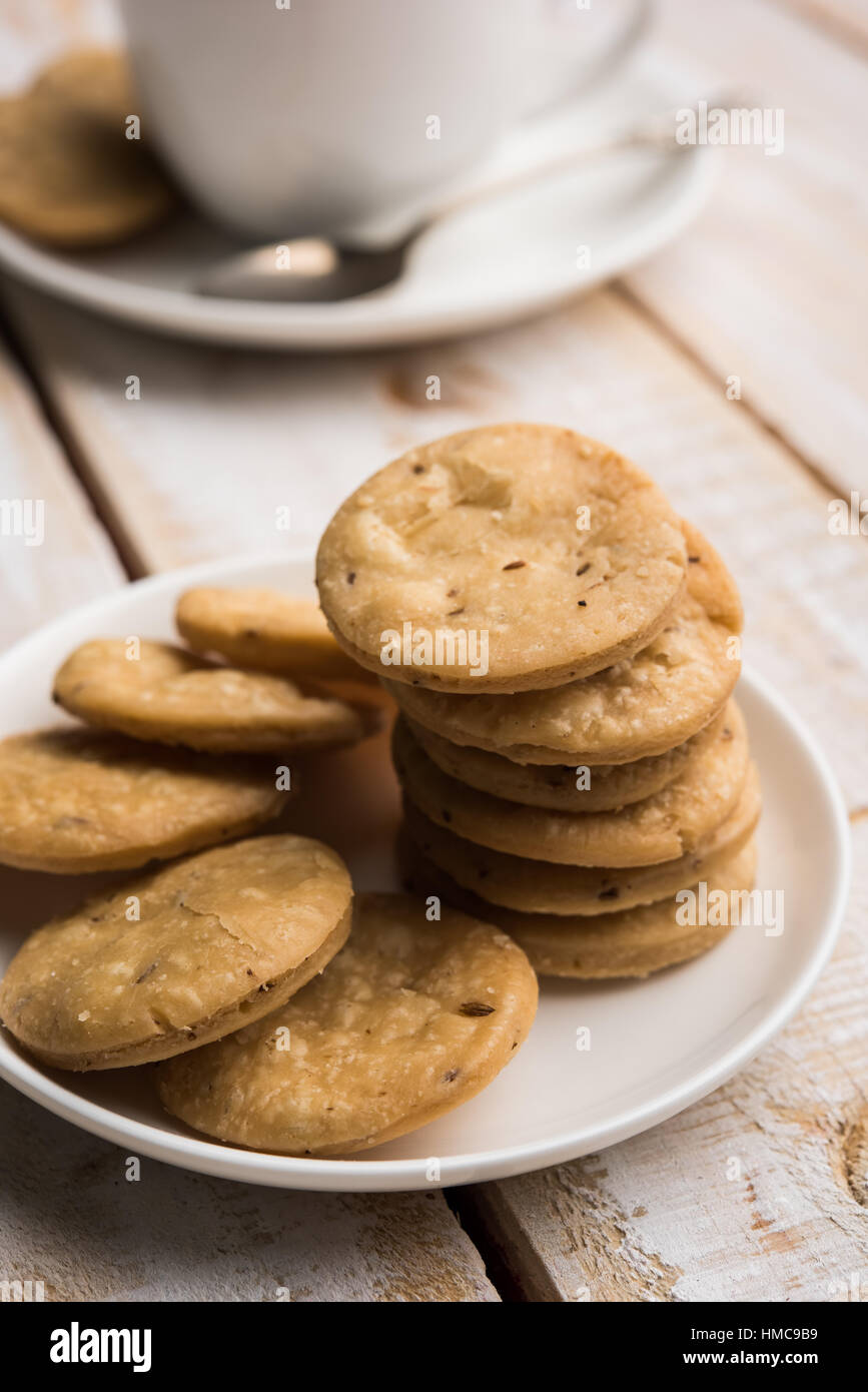 spicy fried mathri or mathari which is an indian snack served with a ...