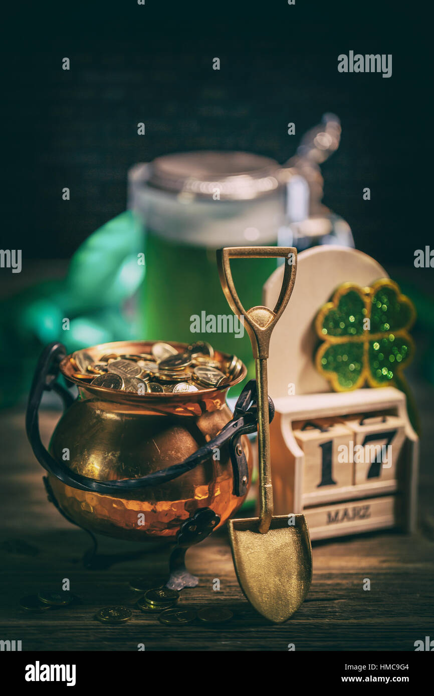 St. Patrick's day concept: Pot full of gold coins and shovel Stock ...